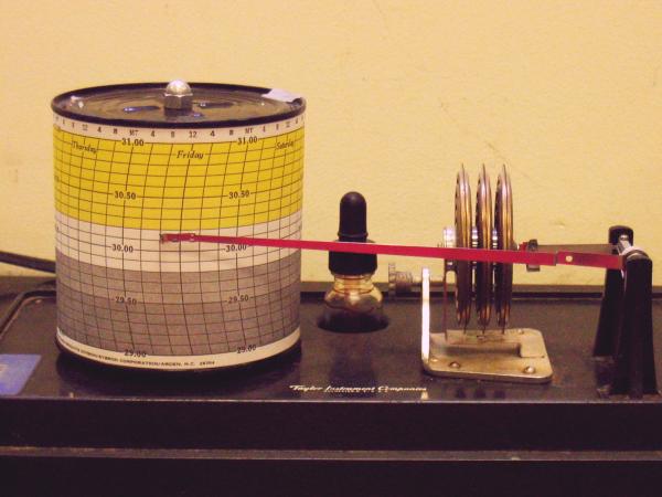 A barograph. As with the thermograph, the drum rotates slowly with time ...